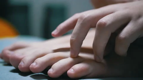 Child Hands Massage Skin the Toe, and Li... | Stock Video | Pond5