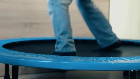 Child jumping on trampoline | Stock Video | Pond5