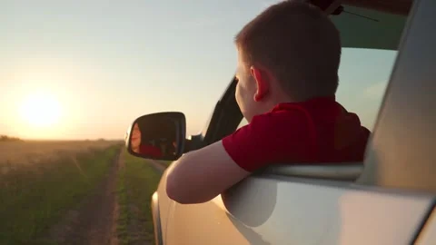 child kid looks out car window, wind pla... | Stock Video | Pond5
