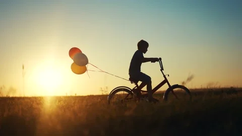 child learns to ride a bike in the park ... | Stock Video | Pond5