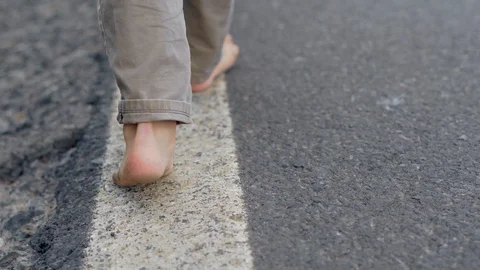 Child legs walking away on road. Childre... | Stock Video | Pond5