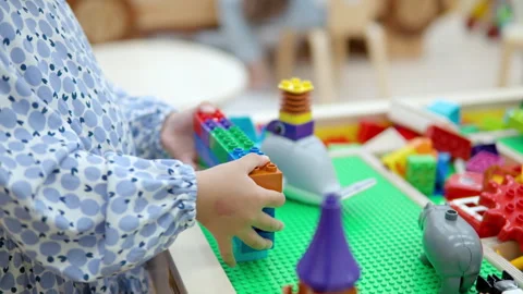 Child Little Girl Playing Constructor Bu... | Stock Video | Pond5