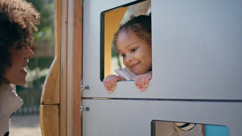 Child looking playground window playing ... | Stock Video | Pond5