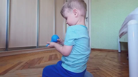 The child looks at the enema.Concepts of... | Stock Video | Pond5