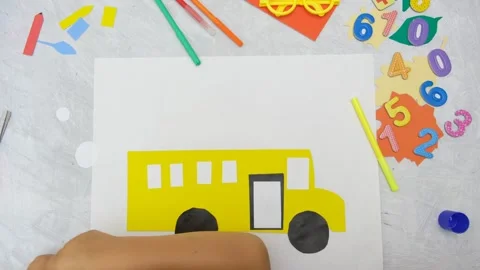 Child making school bus from paper and p... | Stock Video | Pond5