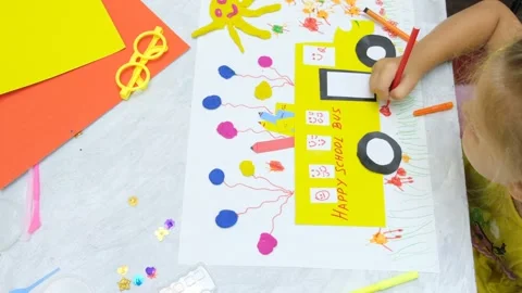 Child making school bus from paper and p... | Stock Video | Pond5
