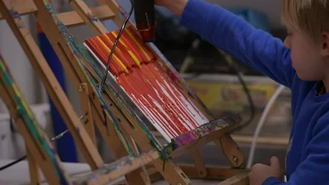 Child melting wax colouring crayons with... | Stock Video | Pond5