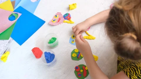 Child modeling craft fun face. Modelin... | Stock Video | Pond5