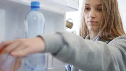 Child Opening Fridge, Girl Taking an Ora... | Stock Video | Pond5