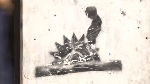 child peeing on PASOK sign stencil | Stock Video | Pond5