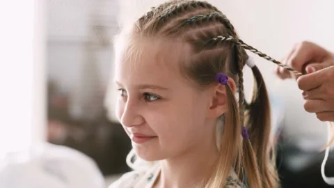 Child with pigtail hairstyle | Stock Video | Pond5