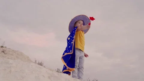 Child playing magician. Child fantasizes... | Stock Video | Pond5