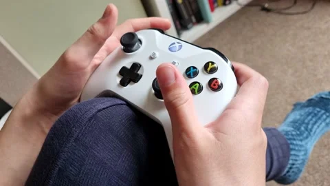 A child playing on an xbox using a wirel... | Stock Video | Pond5