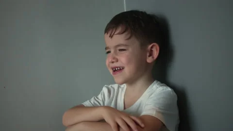 Child punished sitting crying in the cor... | Stock Video | Pond5
