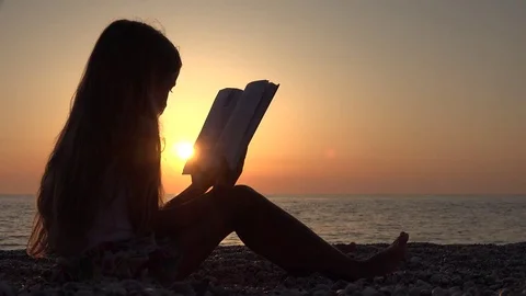 Child Reading Book on Beach, Kid at Suns... | Stock Video | Pond5