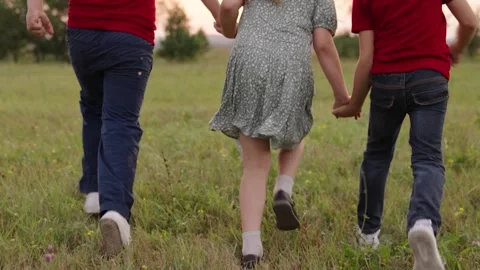 Child running back sunset hand sky sun k... | Stock Video | Pond5