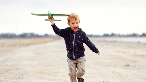 Child Running With Toy Airplane. Kid Boy... | Stock Video | Pond5