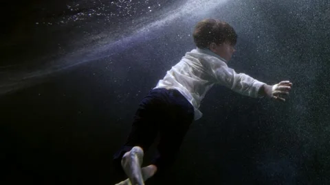 child is sinking in river, underwater sh... | Stock Video | Pond5
