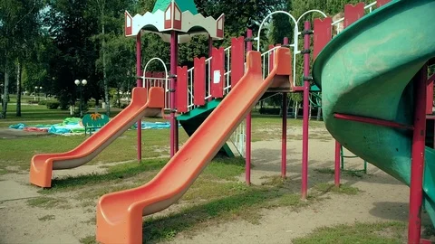 Child Sliding on a Slide in Park, Little... | Stock Video | Pond5