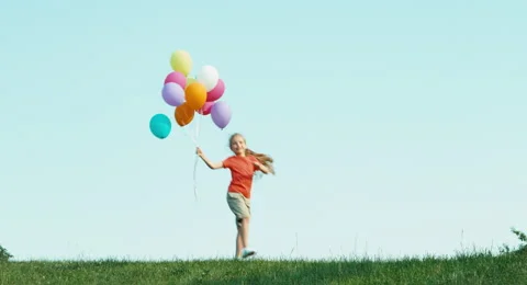 The child spinning with balloons and run... | Stock Video | Pond5