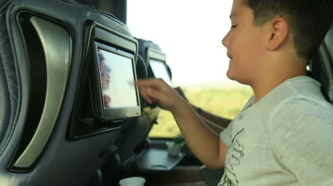 Child watching tv on the bus | Stock Video | Pond5