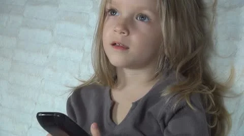 Child Watching TV, Smiling Little Girl H... | Stock Video | Pond5