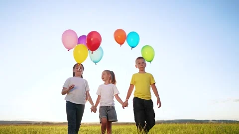 children in balloons in the park. childr... | Stock Video | Pond5