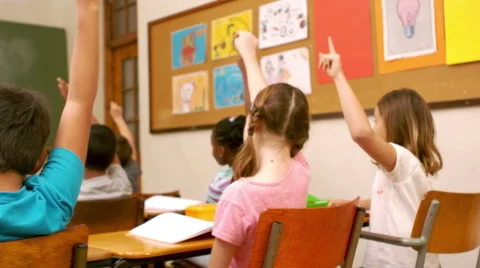 Children classroom raising hands | Stock Video | Pond5