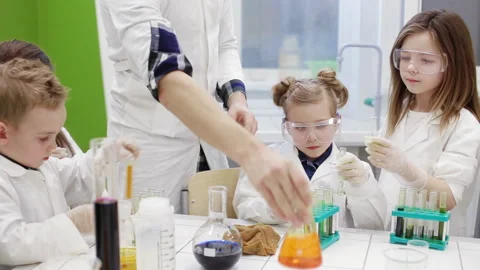 Children do an experiment in a chemistry... | Stock Video | Pond5