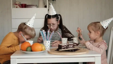 Children Eating Birthday Cake Slice on a... | Stock Video | Pond5