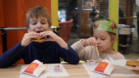 Children in fast food restaurant boy and... | Stock Video | Pond5