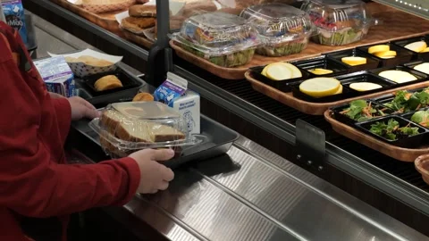 Children go through lunch line in cafete... | Stock Video | Pond5