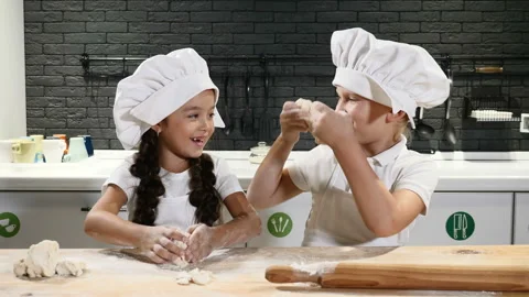 Children have fun while cooking together... | Stock Video | Pond5