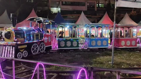 Children having fun riding train in amus... | Stock Video | Pond5