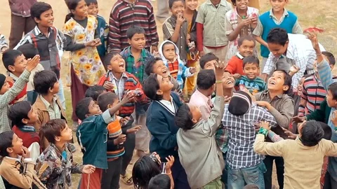 Children in India first saw the drone.. ... | Stock Video | Pond5