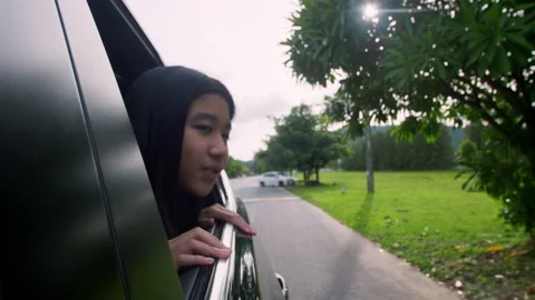 children leaned out the car window and s... | Stock Video | Pond5