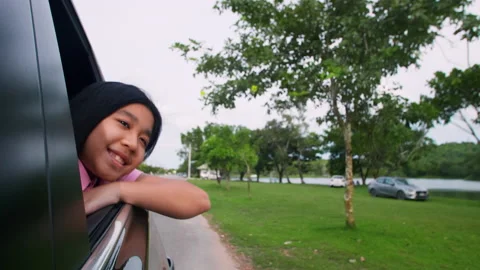 children leaned out the car window and s... | Stock Video | Pond5