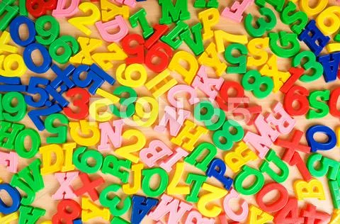 Children letters and digits on the table ~ Premium Photo #36279449