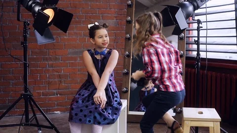 Children photo shoot in the Studio | Stock Video | Pond5