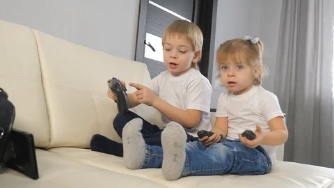 children a play console in gamepads team... | Stock Video | Pond5