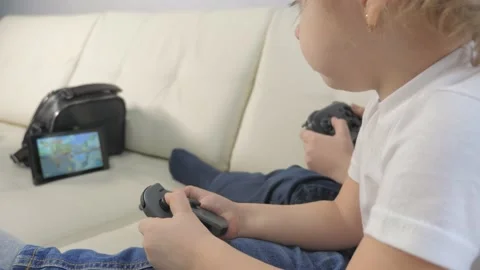 children a play console in gamepads team... | Stock Video | Pond5