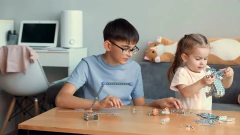 Children play with a metal constructor a... | Stock Video | Pond5