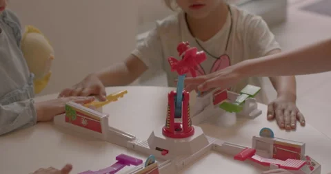 Children play with plastic toy together.... | Stock Video | Pond5