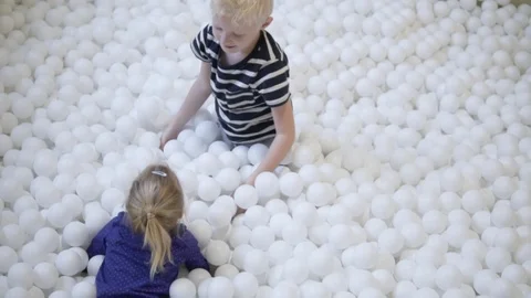 Children play in the pool with balls. | Stock Video | Pond5