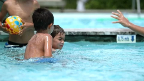 Children playing at the book with ball c... | Stock Video | Pond5