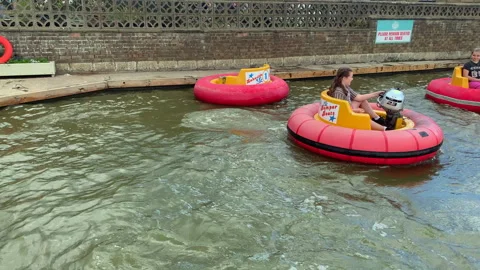 Children playing in bumper boats on the ... | Stock Video | Pond5