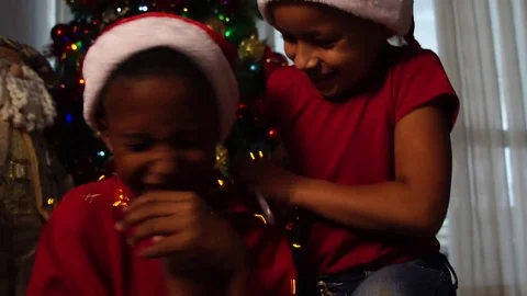 Children playing with Christmas lights | Stock Video | Pond5