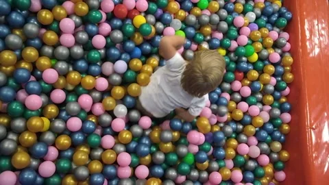 Children playing in colorful ball pit. I... | Stock Video | Pond5