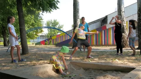 Children playing limbo dance game outdoo... | Stock Video | Pond5