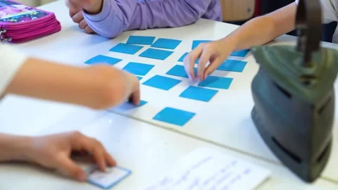 Children playing a matching game at a ta... | Stock Video | Pond5